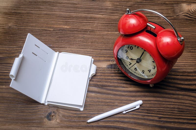 Notepad with Blank Pages and Copy Space and Retro Style Alarm Clock ...