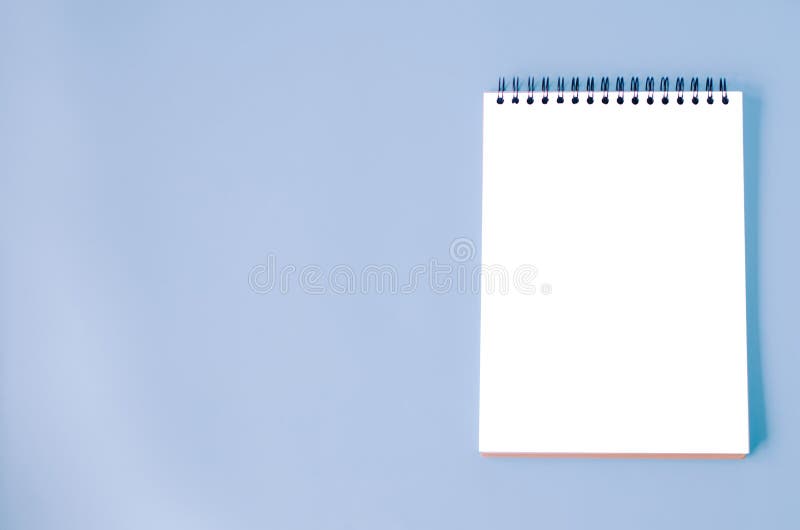 Notepad is on a Blue Background. Stock Image - Image of abstract ...