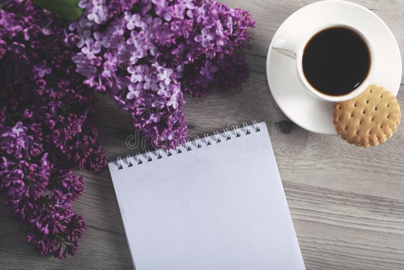 Notepad and Coffee with Lilac on Table Stock Image - Image of workspace ...