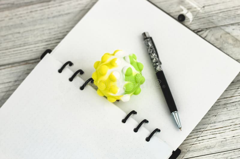 Notepad Diary with Pen and Anti-stress Ball on the Desktop Stock Photo ...