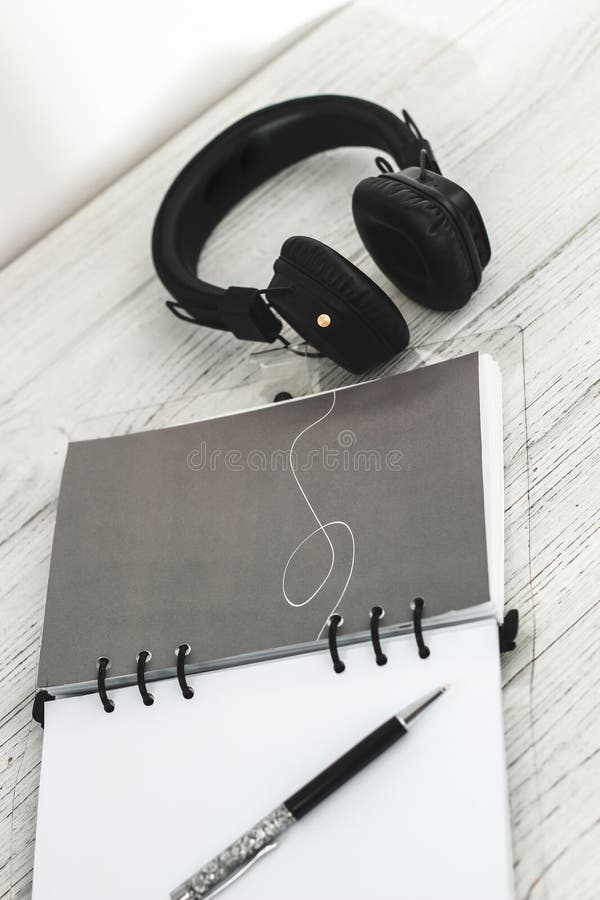 Notepad Diary with Pen and Headphones on the Desktop Stock Photo ...