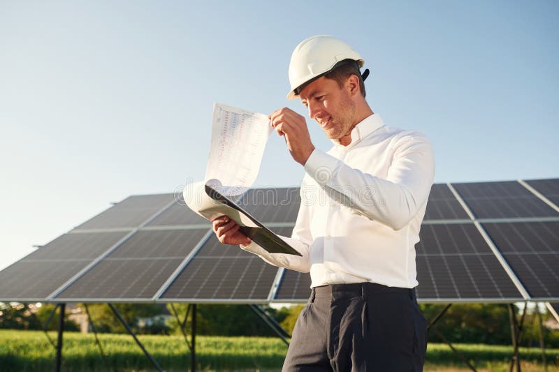 Notepad with Document is in Hands. Man is Doing Operating and ...