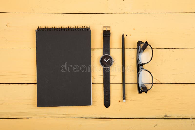 Notepad, Eyeglasses and Watches on the Desk Stock Image - Image of ...