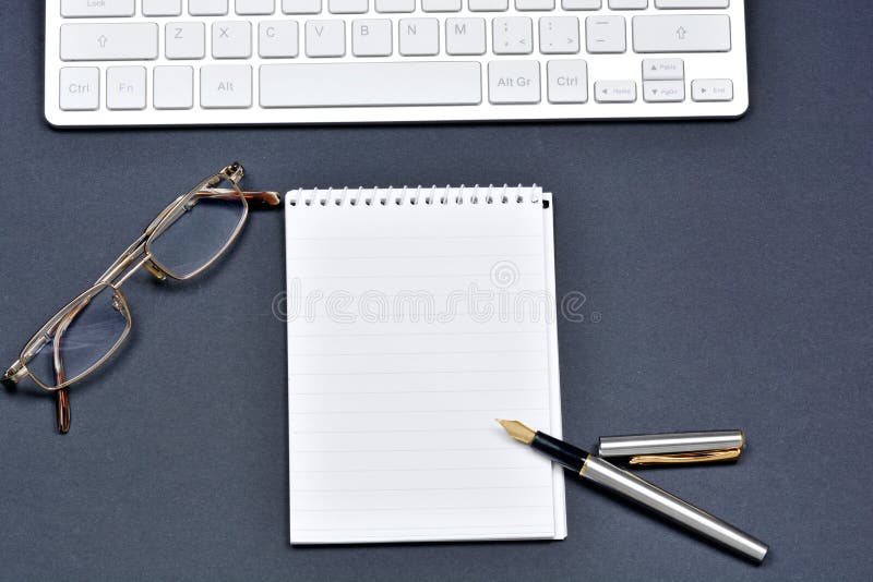 Notepad with Fountain Pen, Eyeglasses and Keyboard Computer Stock Image ...