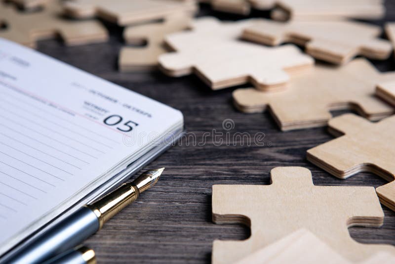 Notepad with a Fountain Pen and Puzzle Pieces Stock Photo - Image of ...