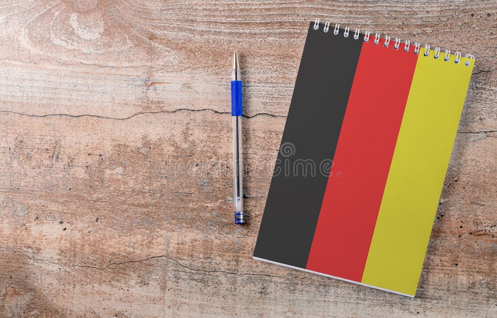 Notepad with Germany Flag, Pen on Wooden Background Stock Photo - Image ...