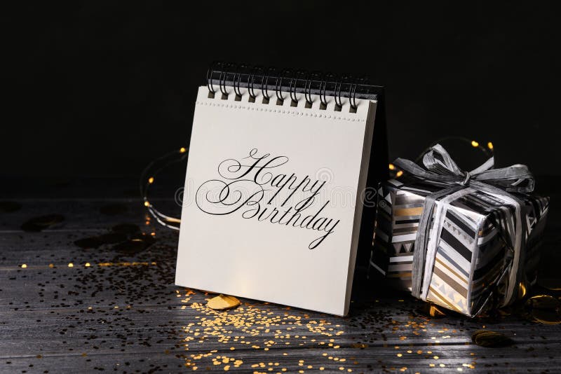 Notepad with Greeting HAPPY BIRTHDAY and Gift on Table Stock Image ...
