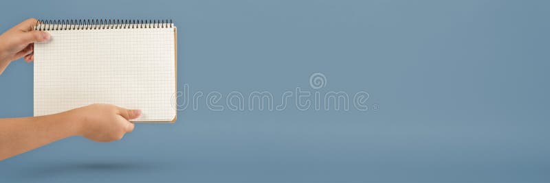 Notepad in Hand. Blank Notepad in the Hands on a Blue Background. Hands ...
