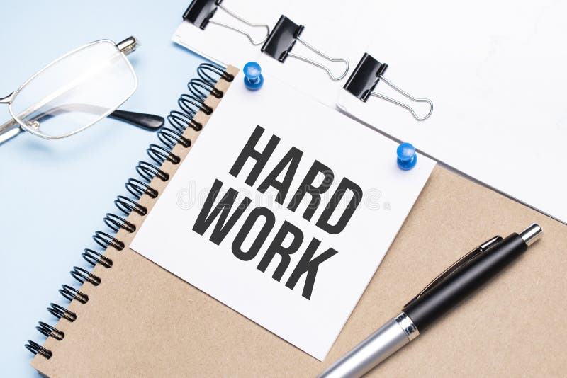 Notepad with HARD WORK Text on the Office Table with Glasses, Notepad ...