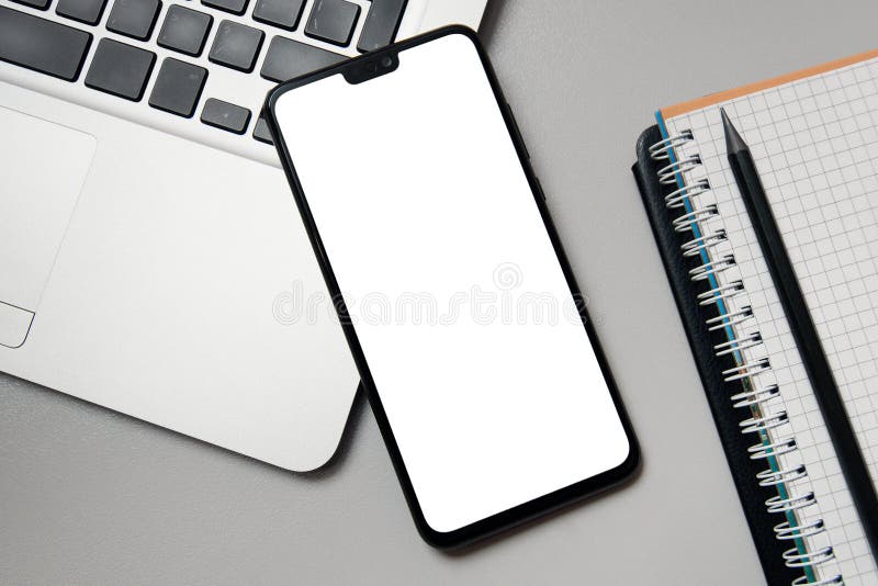 Notepad, Laptop and Mobile Phone on Table Stock Image - Image of list ...