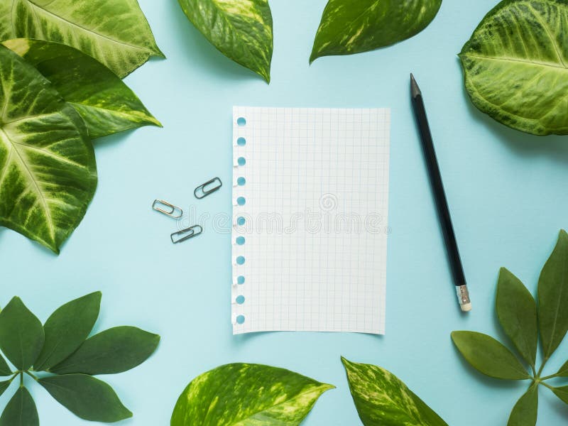 Notepad Leaf with Pencil in the Center on Blue Background with Green ...