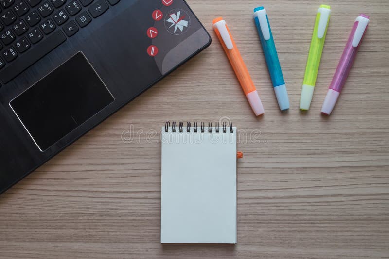 Notepad, Marker Pens and Laptop on Wood. Stock Image - Image of ...