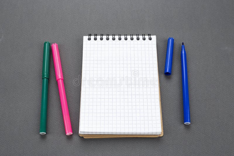 Notepad and markers stock image. Image of accessories - 148706619