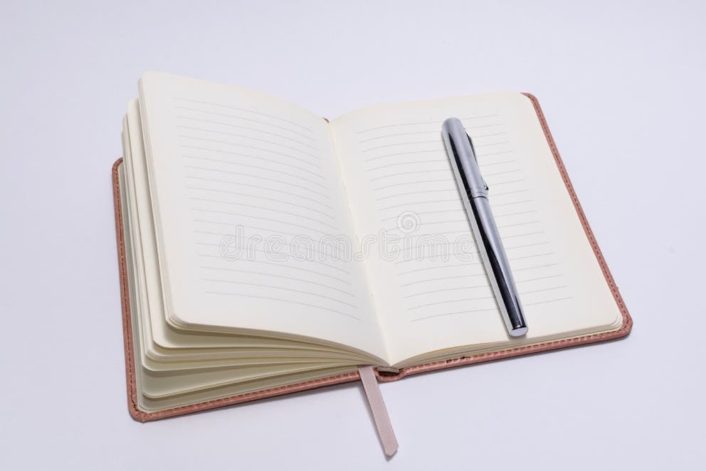 Notepad and metal pen stock photo. Image of pages, note - 202367398