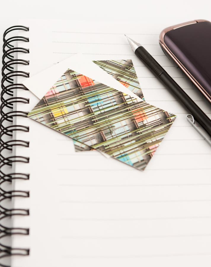 Notepad and mobile phone stock photo. Image of phone - 21540842