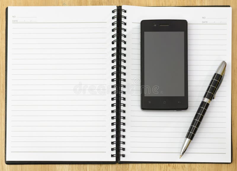 Notepad with mobile phone stock image. Image of book - 33761599