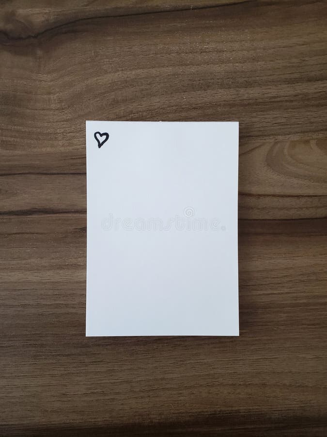 Notepad Over a Wooden Table with a Heart in the Left Upper Corner Stock ...