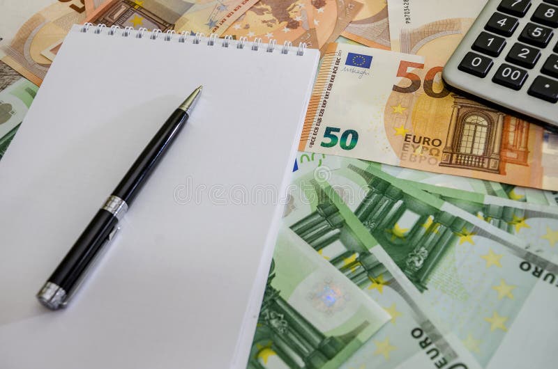 Notepad, Pen and Calculator on a Euro Background Stock Photo - Image of ...