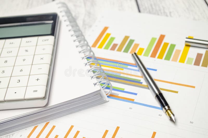 Notepad with Pen and Calculator on the Paper Graphs. Business Concept ...