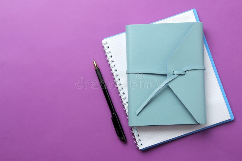 Notepad and Pen on a Purple Background. Top View. Stock Image - Image ...