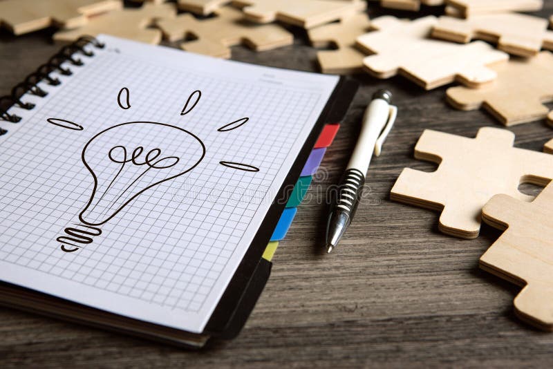 Notepad with a Pen and Puzzle Pieces Stock Photo - Image of guess ...