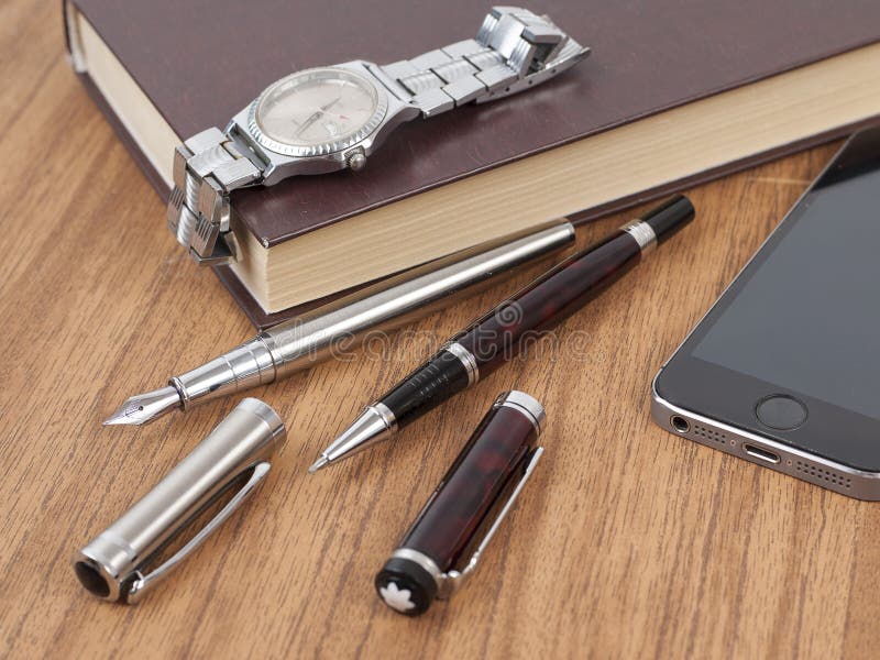 Notepad, Pen and Watches on the Wood Desk Stock Photo - Image of gold ...