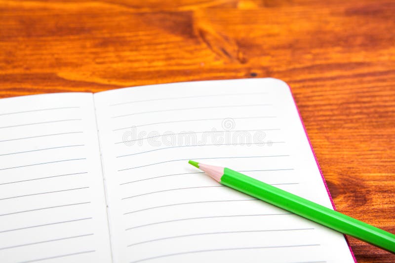 Notepad with Pencil on Wood Board Background.using Wallpaper for ...