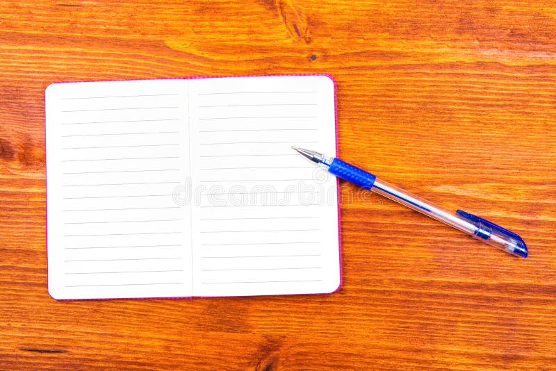 Notepad with Pencil on Wood Board Background.using Wallpaper for ...