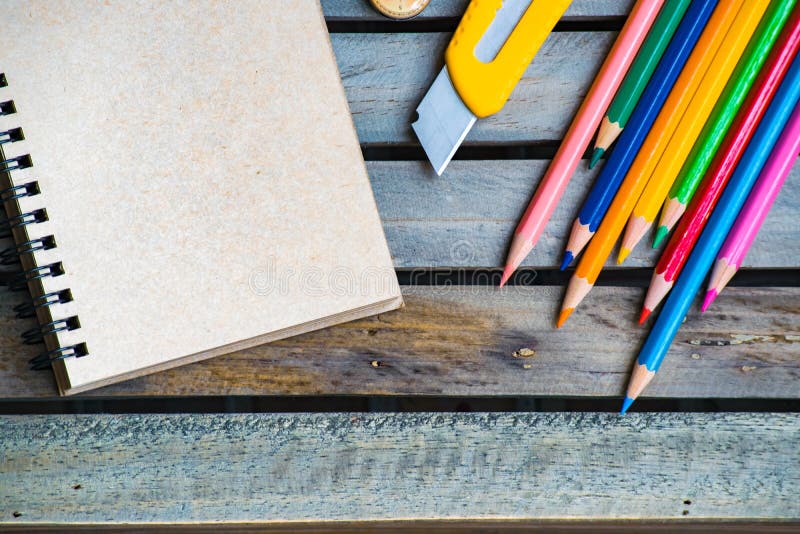 Notepad with Pencil on Wood Board Background.using Wallpaper for ...