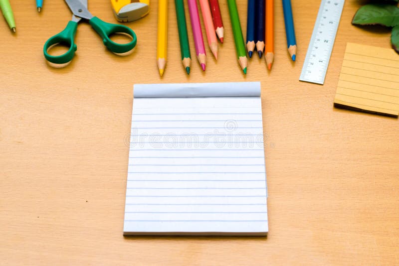 Notepad with Pencil on Wood Board Background.using Wallpaper for ...