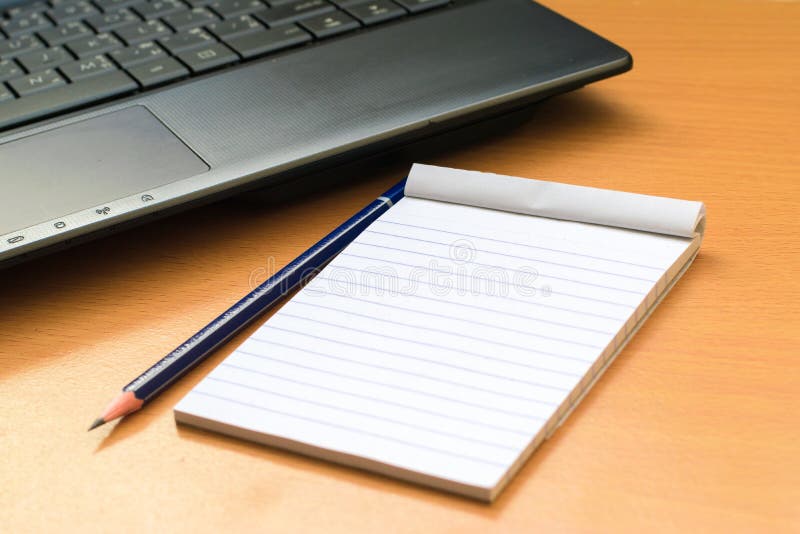 Notepad with Pencil on Wood Board Background.using Wallpaper for ...