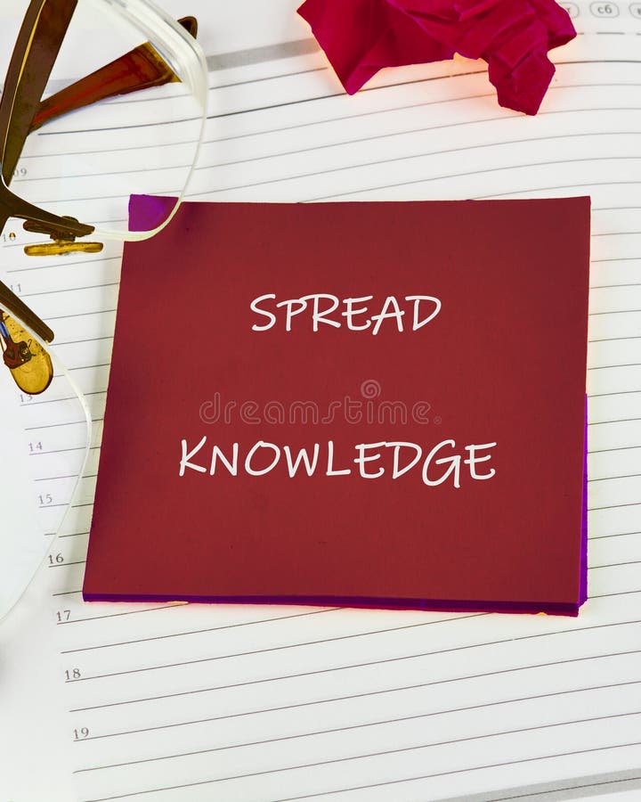 A Notepad with the Phrase Spread Knowledge Highlights the Importance of Education and Sharing ...