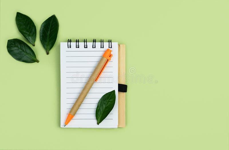 Notepad with Recycled Paper Pen on a Green Background. Zero Waste ...
