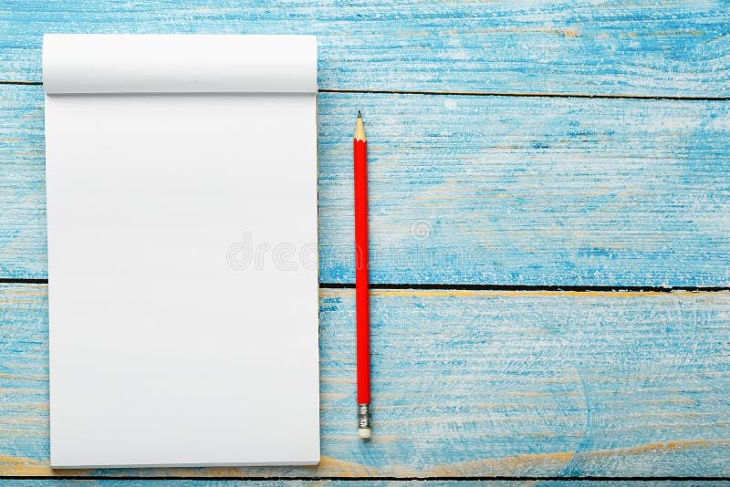 Notepad with Red Pencil on a Blue Wooden Table Background, for ...