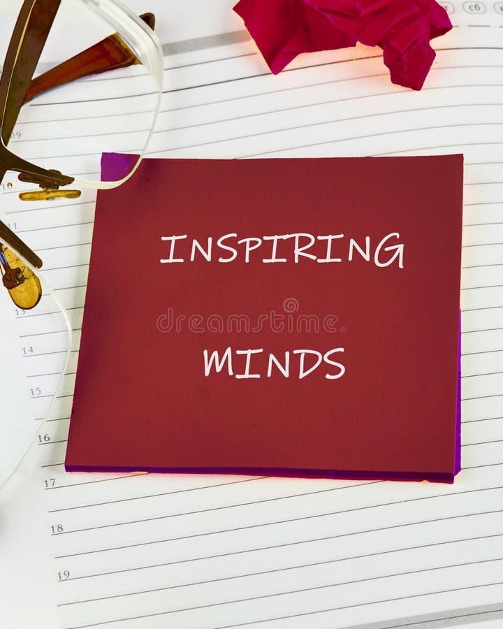 A Notepad Showcases the Phrase Inspiring Minds, Symbolizing Education ...