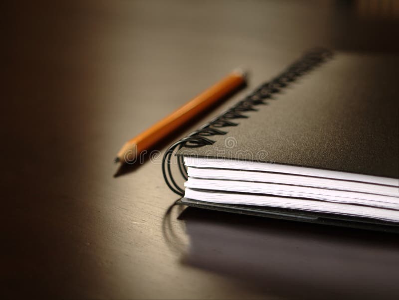 Notepad sitting on a desk stock image. Image of binder - 30234395