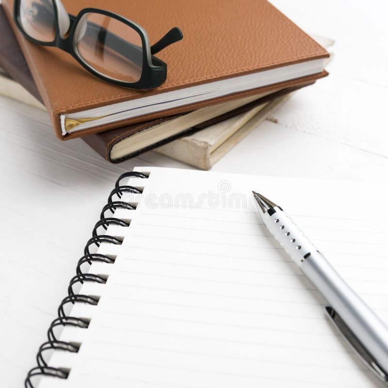 Notepad with stack of book stock image. Image of note - 60427217