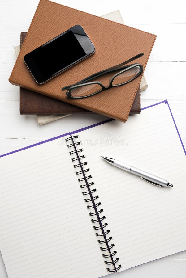 Notepad with stack of book stock photo. Image of diary - 60252112