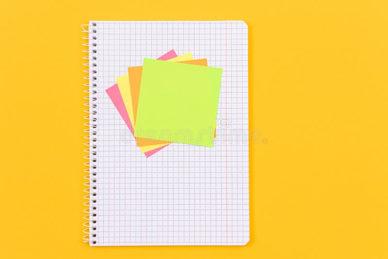 A Notepad with Sticky Notes on Yellow Table Stock Photo - Image of ...