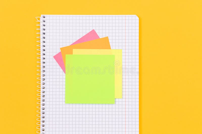 A Notepad with Sticky Notes on Yellow Table Stock Image - Image of ...
