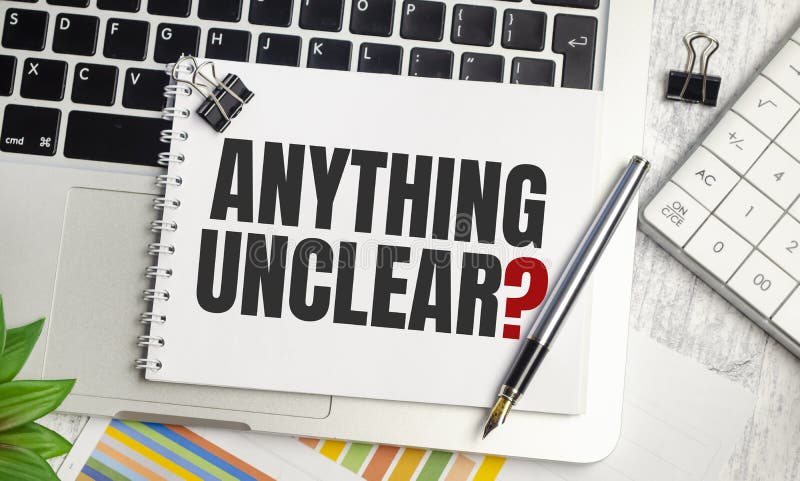 Notepad with the Text ANYTHING UNCLEAR on Laptop Stock Image - Image of ...
