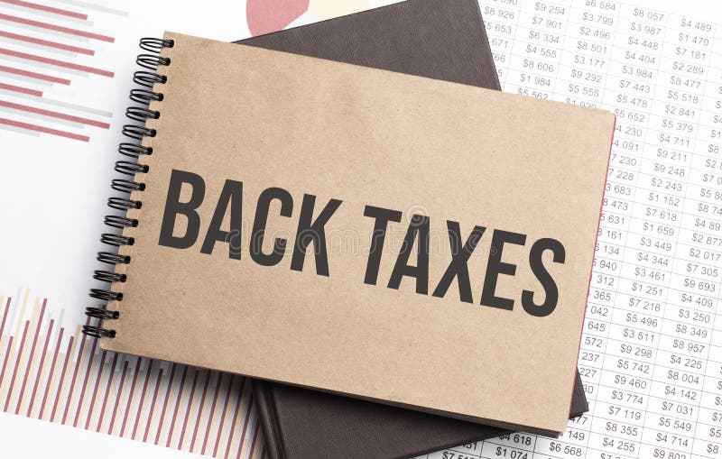 Notepad with Text BACK TAXES on a Charts and Numbers. Business Concept ...