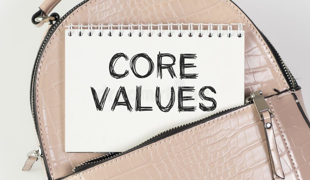 Core Values. a Notebook Peeks Out of the Pocket of a Pink Bag Stock ...