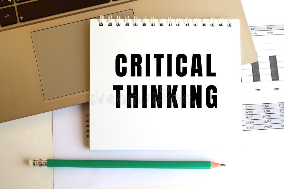 Notepad with the Text CRITICAL THINKING is on the Laptop Keyboard ...