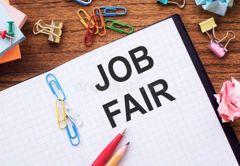 Notepad with the Text JOB FAIR on the Table with Colored Paper Clips ...