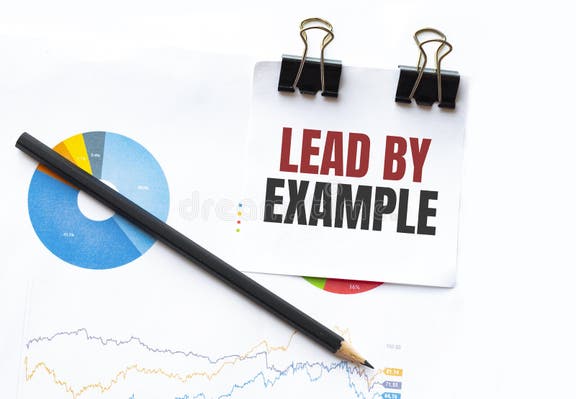 Notepad with Text LEAD by EXAMPLE on Business Charts and Pen Stock ...