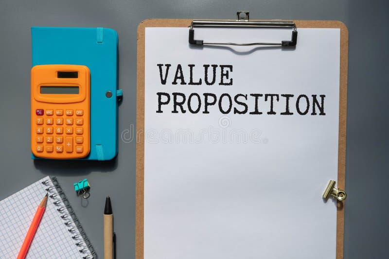 A Notepad with the Text VALUE PROPOSITION, a Pen, Reports, Bright ...