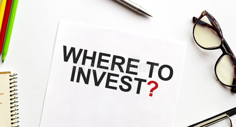 Notepad with Text Where To Invest , on Business Charts and Pen and ...