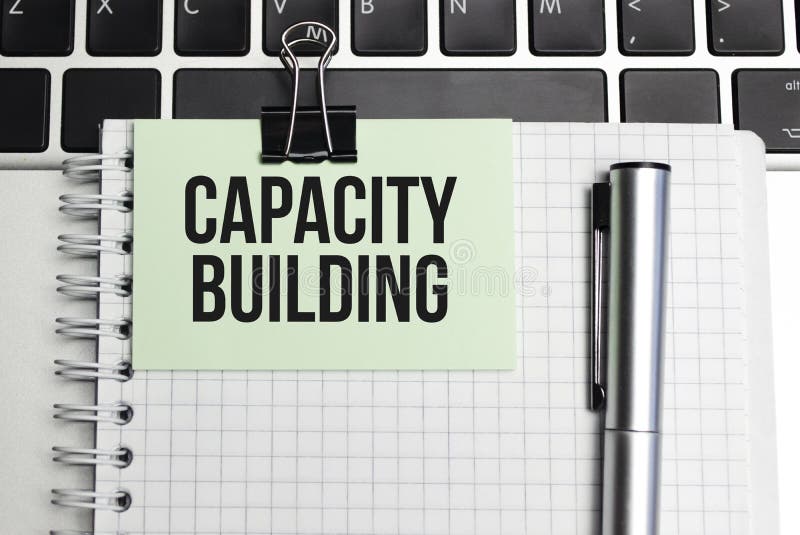 Notepad with the Text Word Capacity Building on Laptop Stock Photo ...