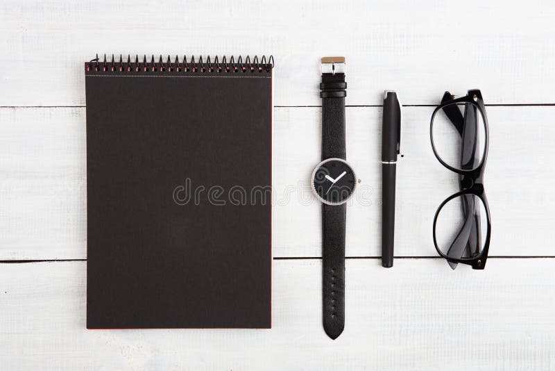 Notepad, Watches, Pen and Reading Glasses on the Desk Stock Photo ...
